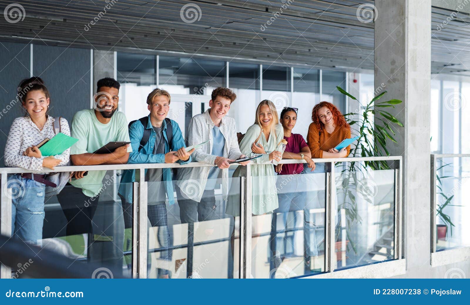 University Students Standing and Looking at Camera Indoors, Back To ...