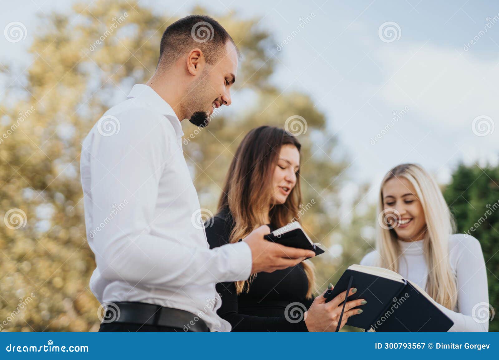 University Students Study Together Outside: Discussing Subjects ...