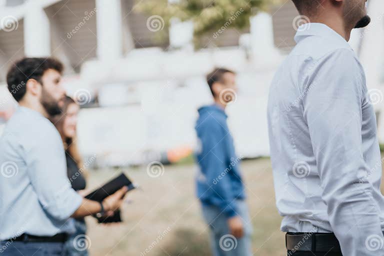 University Students Studying Outdoors, Discussing Topics, Sharing ...