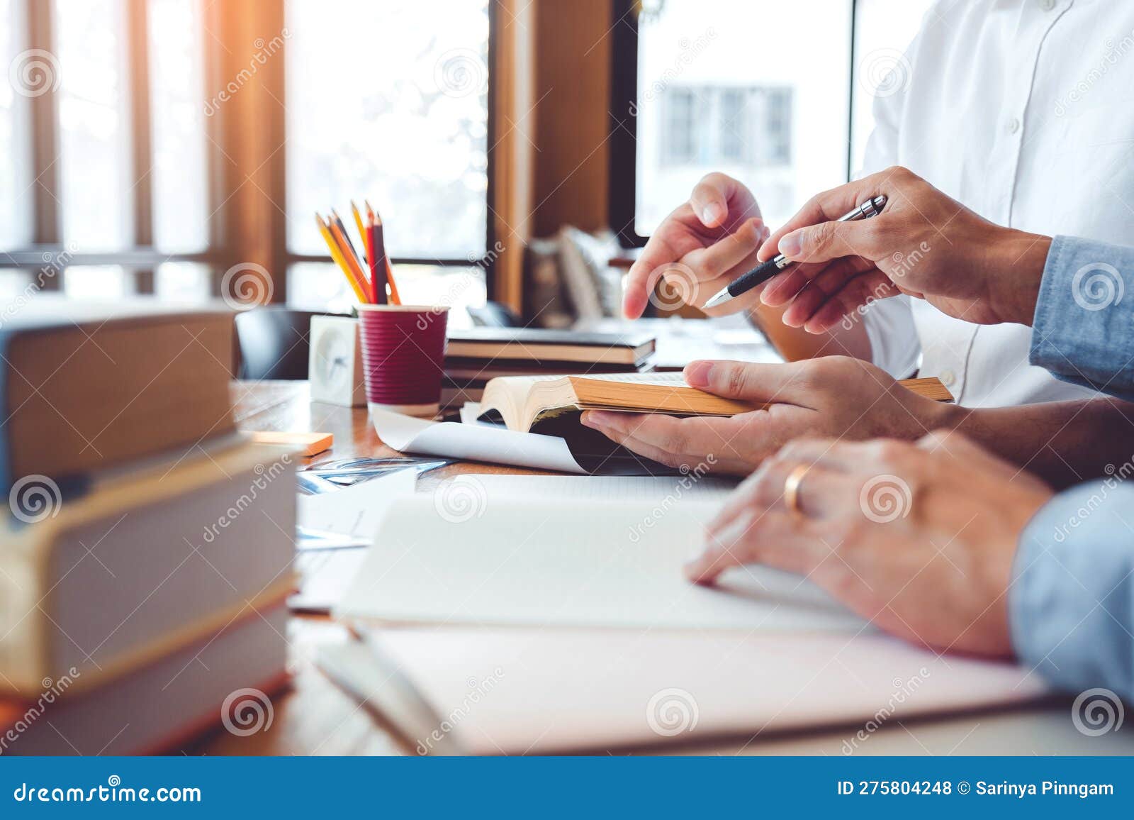 University Students Studying and Reading Together in Library Research ...