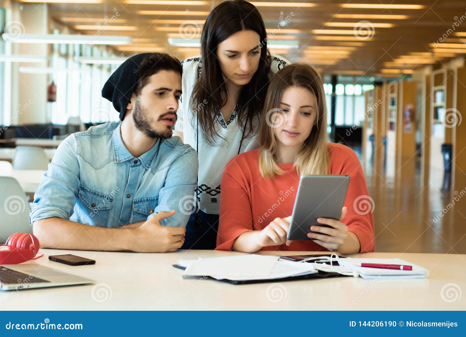 University Students Using Digital Tablet in University Library Stock ...