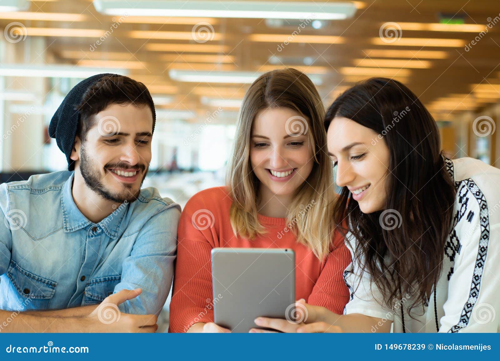 University Students Using Digital Tablet in University Library Stock ...