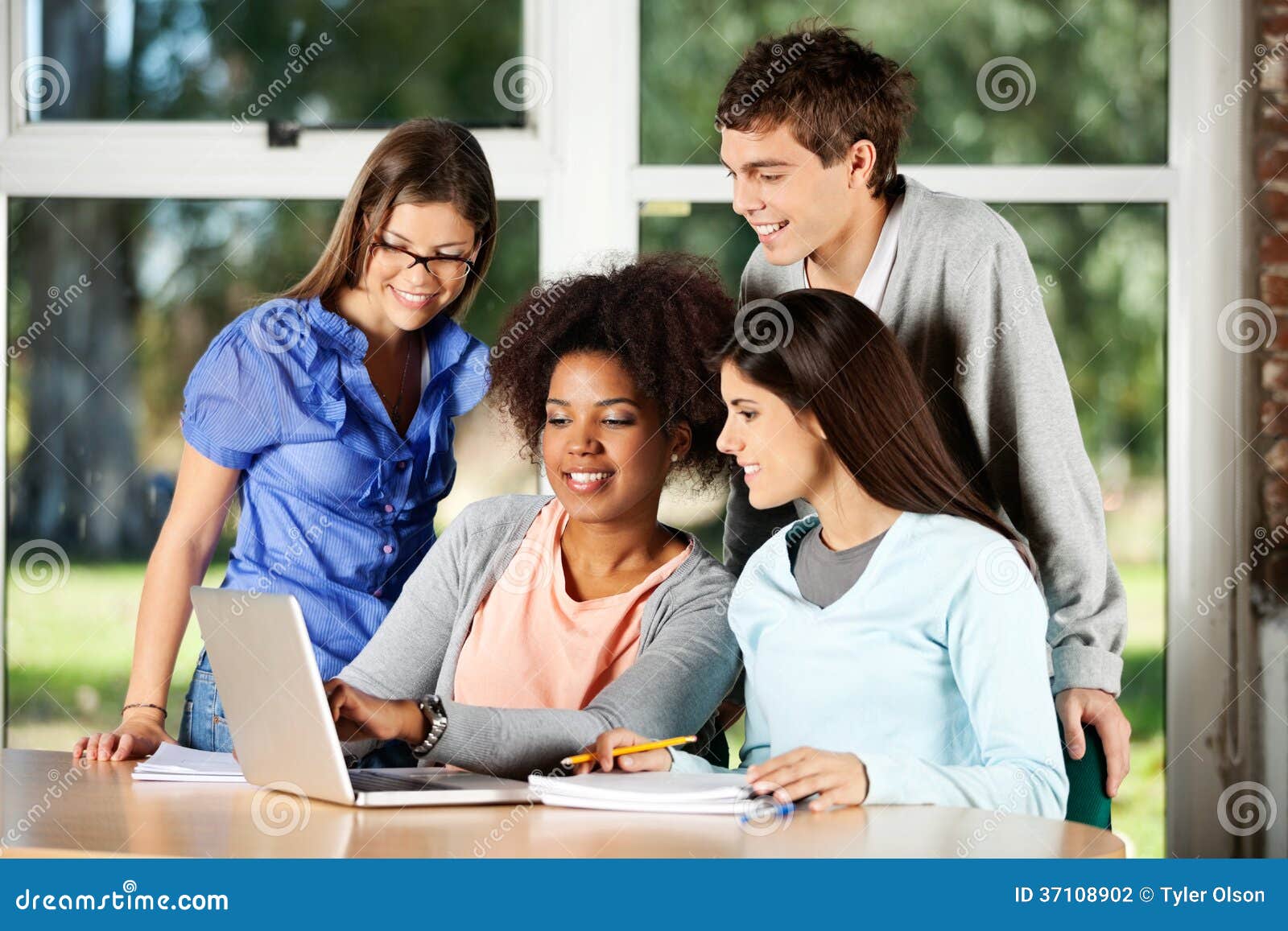 University Students Using Laptop at Desk in Stock Photo - Image of male ...