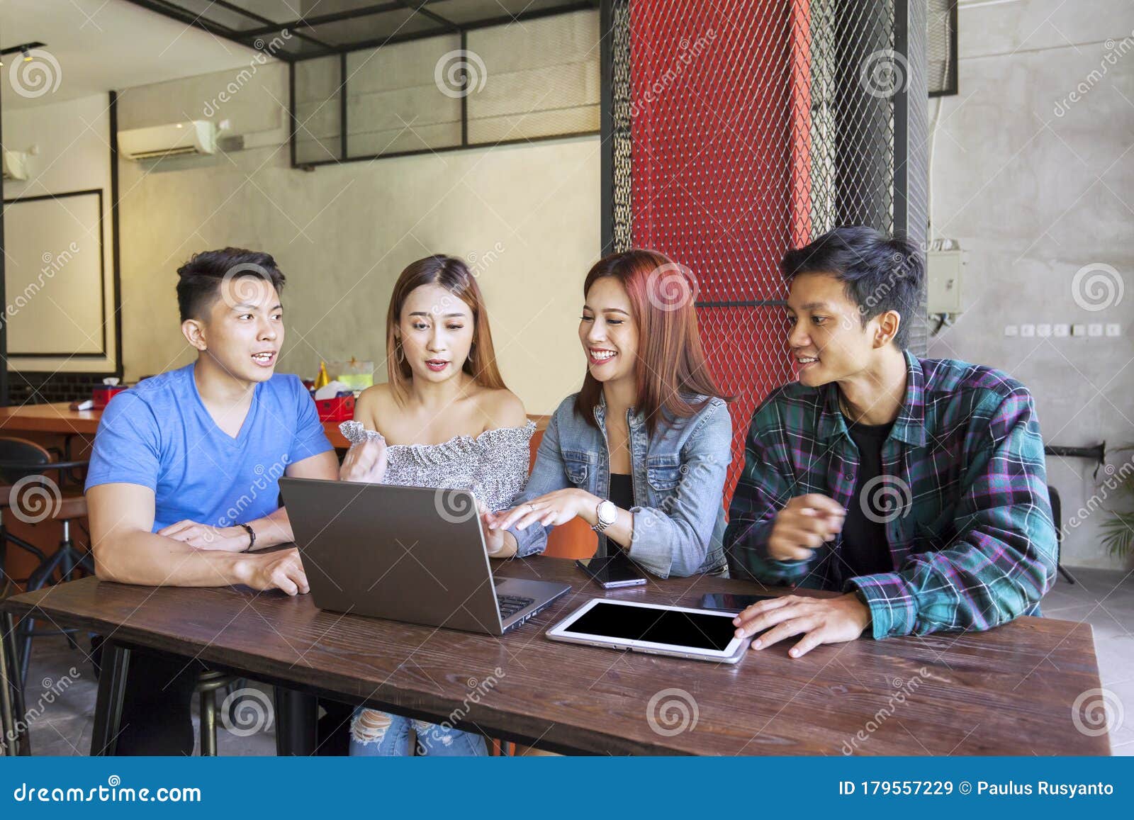University Students Using Laptop Together in Cafe Stock Image - Image ...