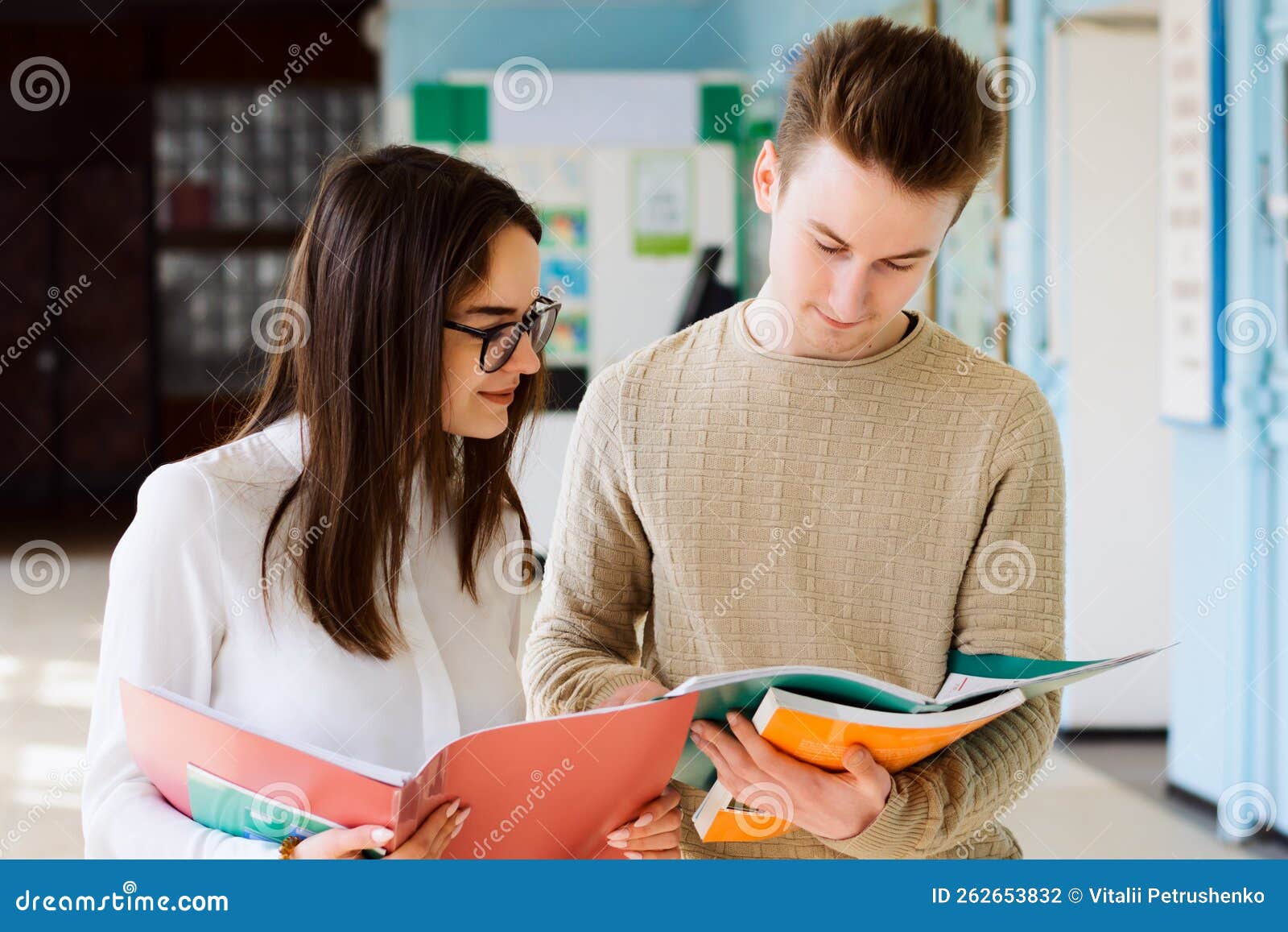 Hardworking Learners Working with Papers and Folders in College Stock ...