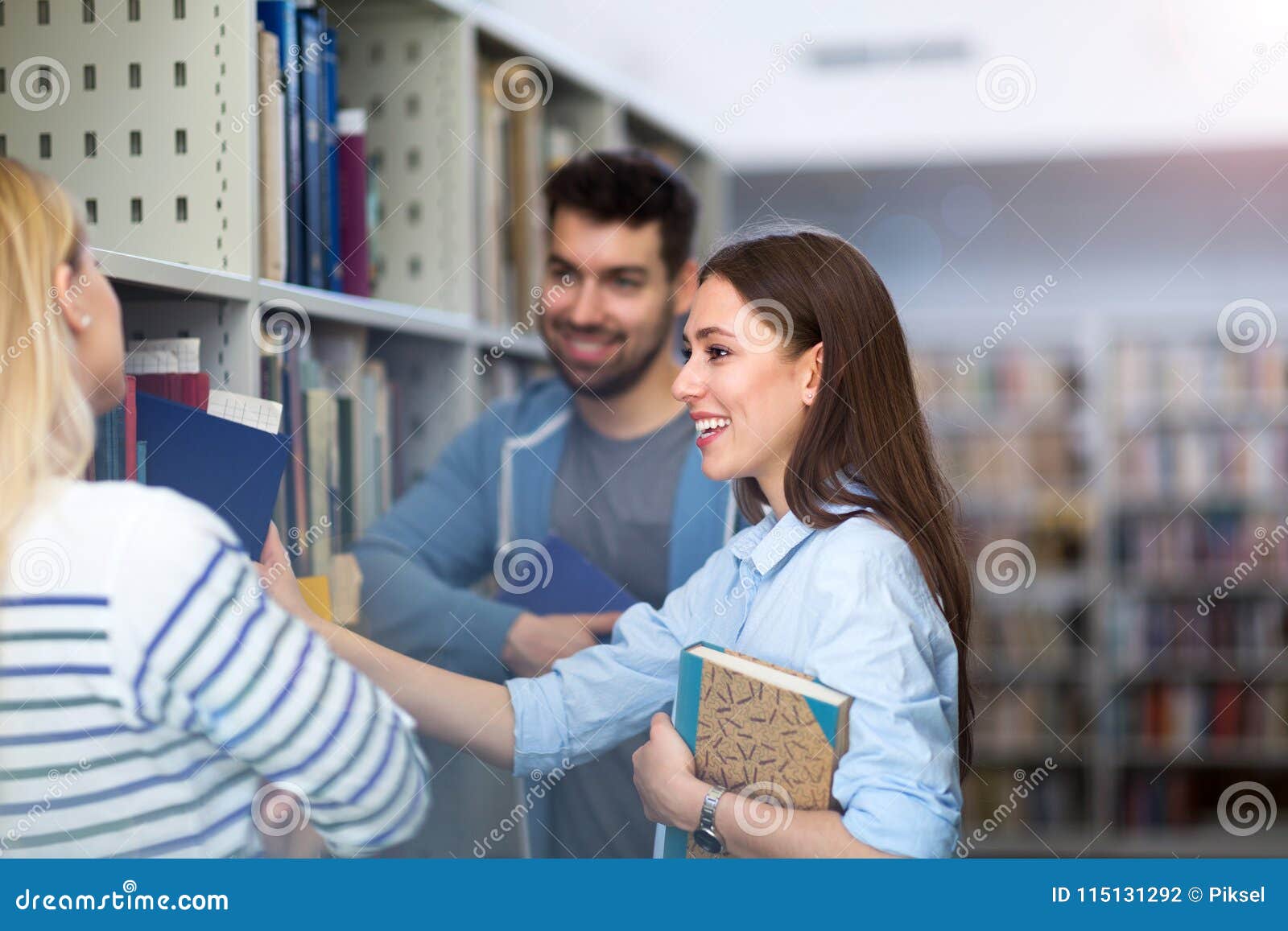 Students Working in the Library at Campus Stock Photo - Image of ...