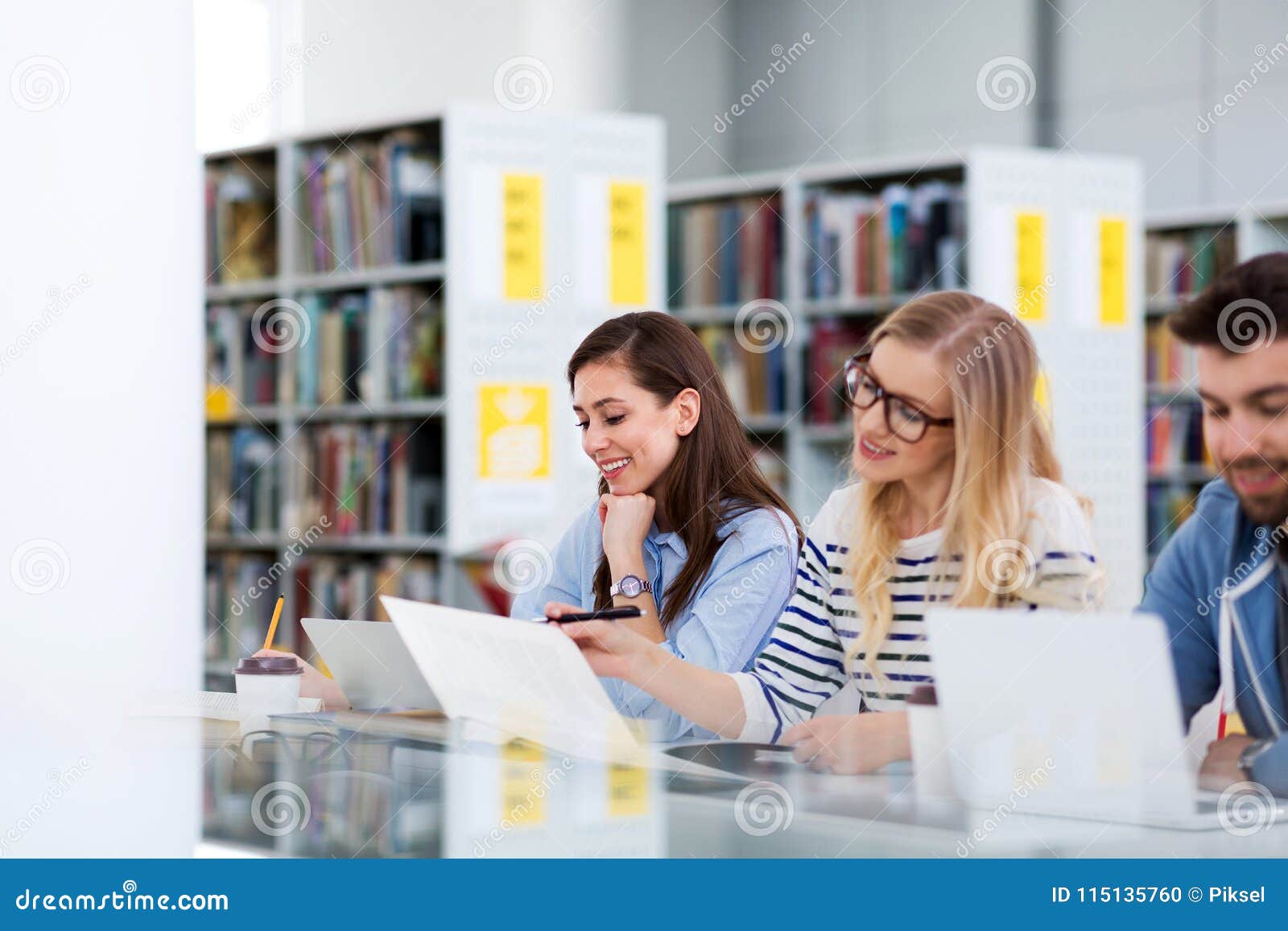 Students Working in the Library at Campus Stock Photo - Image of ...