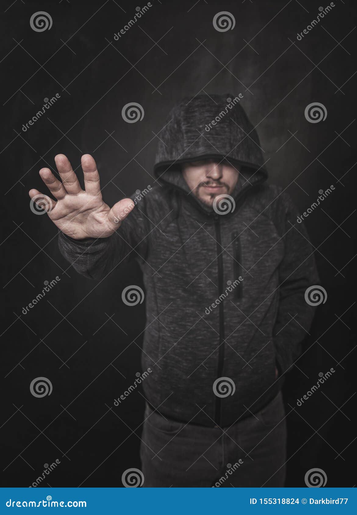 Unknown Man in Hood Pointing by Hand on Dark. Focus on Hand Stock Photo ...