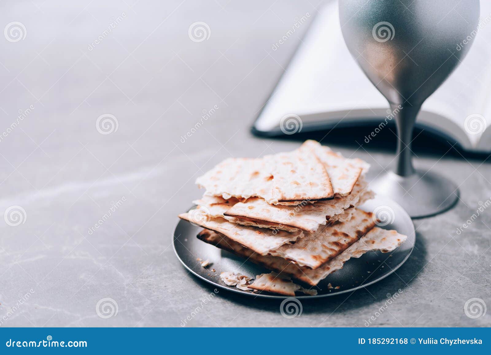 Unleavened Bread, Chalice of Wine, Holy Bible on Grey Background ... Unleavened Bread, Chalice of Wine, Holy Bible on Grey Background ...