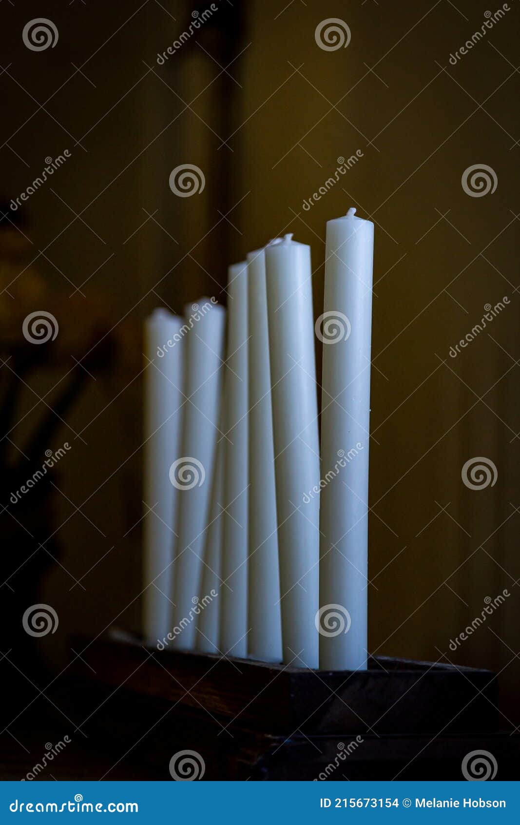 Unlit Candles in a Church stock photo. Image of focus - 215673154