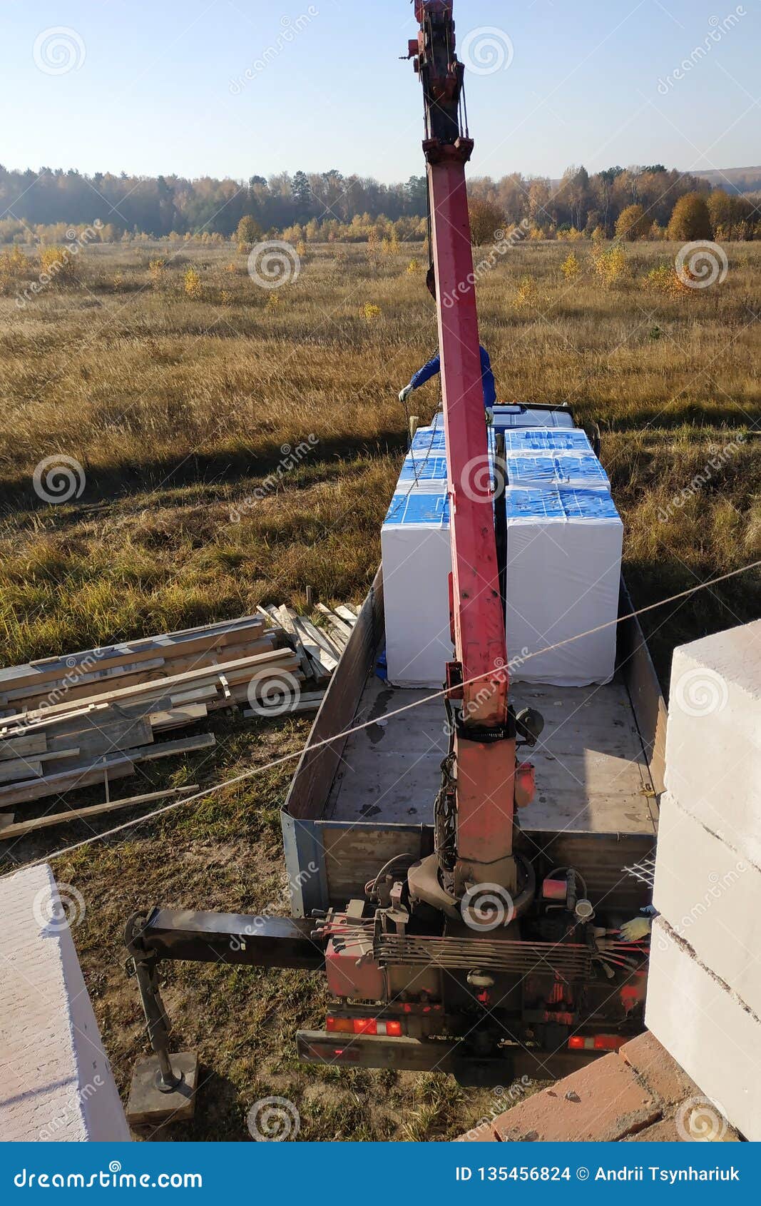 Unloading of Blocks by Automobile Crane on the Construction Site Stock ...