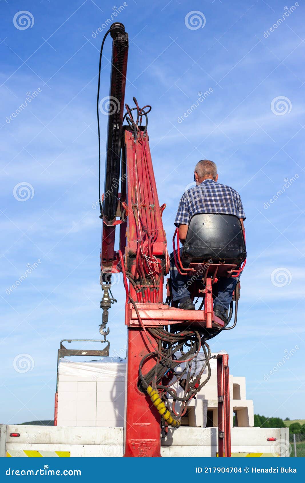 Unloading Building Blocks from a Truck Using a Crane. Hydraulic ...