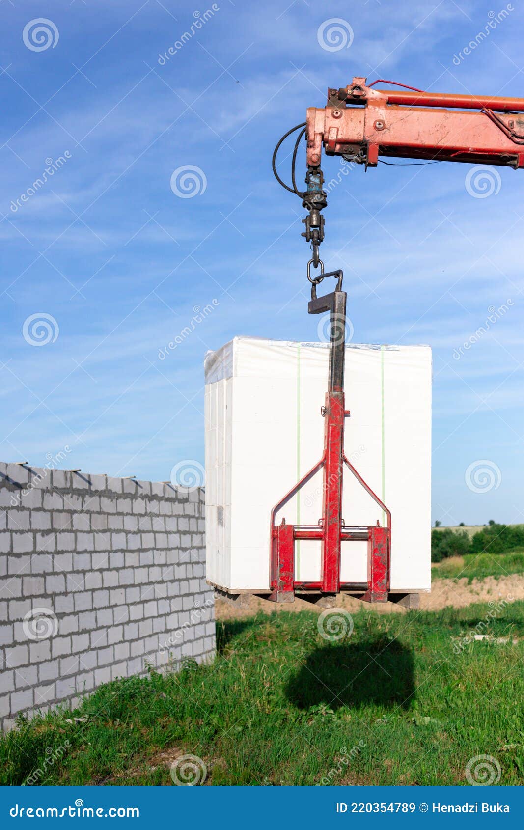Unloading Building Blocks from a Truck Using a Crane. Hydraulic ...