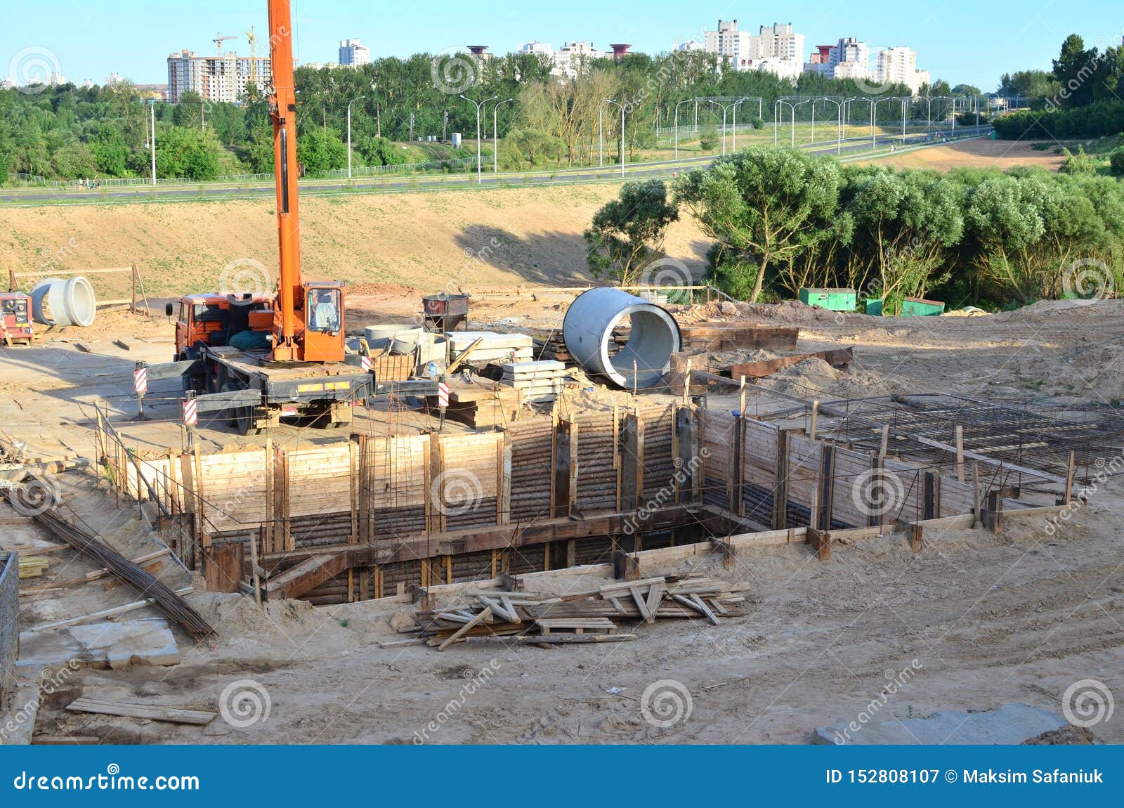 Unloading of Cargo and Building Materials by Mobile Truck Crane at the ...