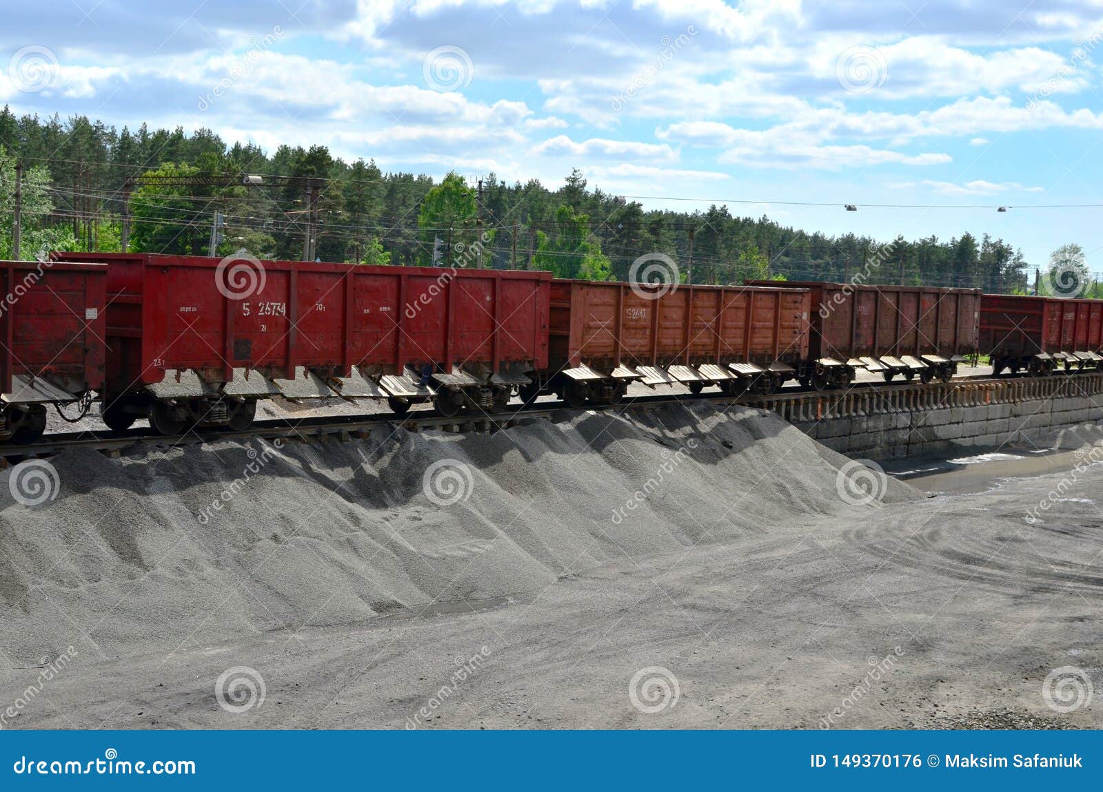 Unloading of Crushed Stone from Railway Car. Stock Photo - Image of ...