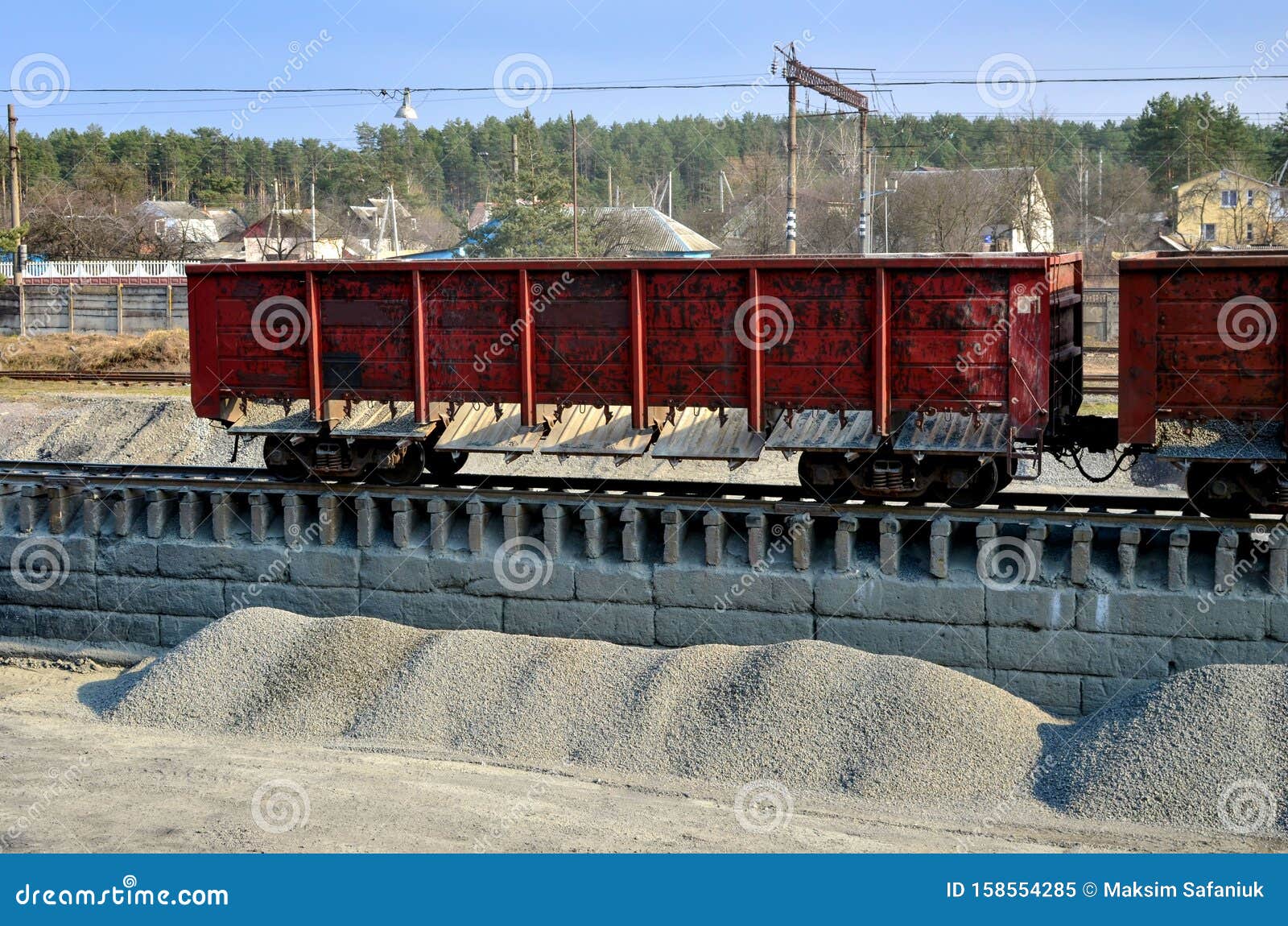 Unloading of Crushed Stone a Railway Car of a Dump Truck, Closeup ...