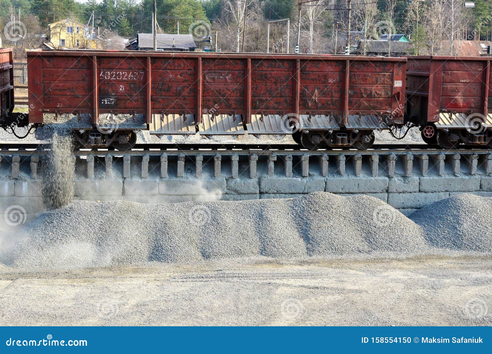 Unloading of Crushed Stone a Railway Car of a Dump Truck, Closeup ...
