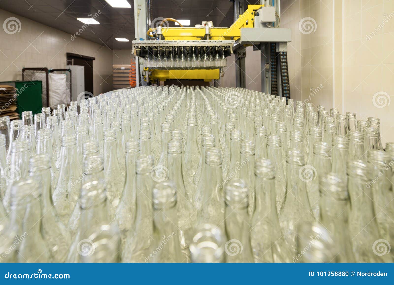 Unloading Glass Bottles with an Automatic Machine. Stock Photo - Image ...