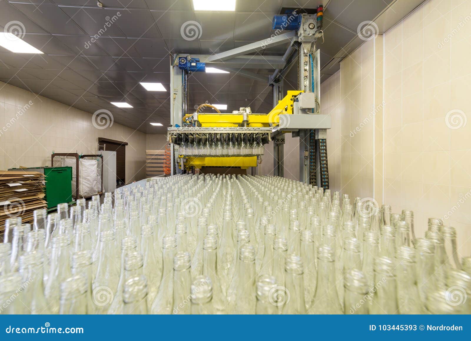 Unloading Glass Bottles with an Automatic Machine. Stock Image - Image ...