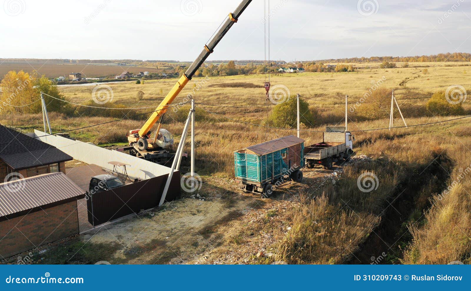 Crane And Large Recycling Bin Stock Photo | CartoonDealer.com #219760470