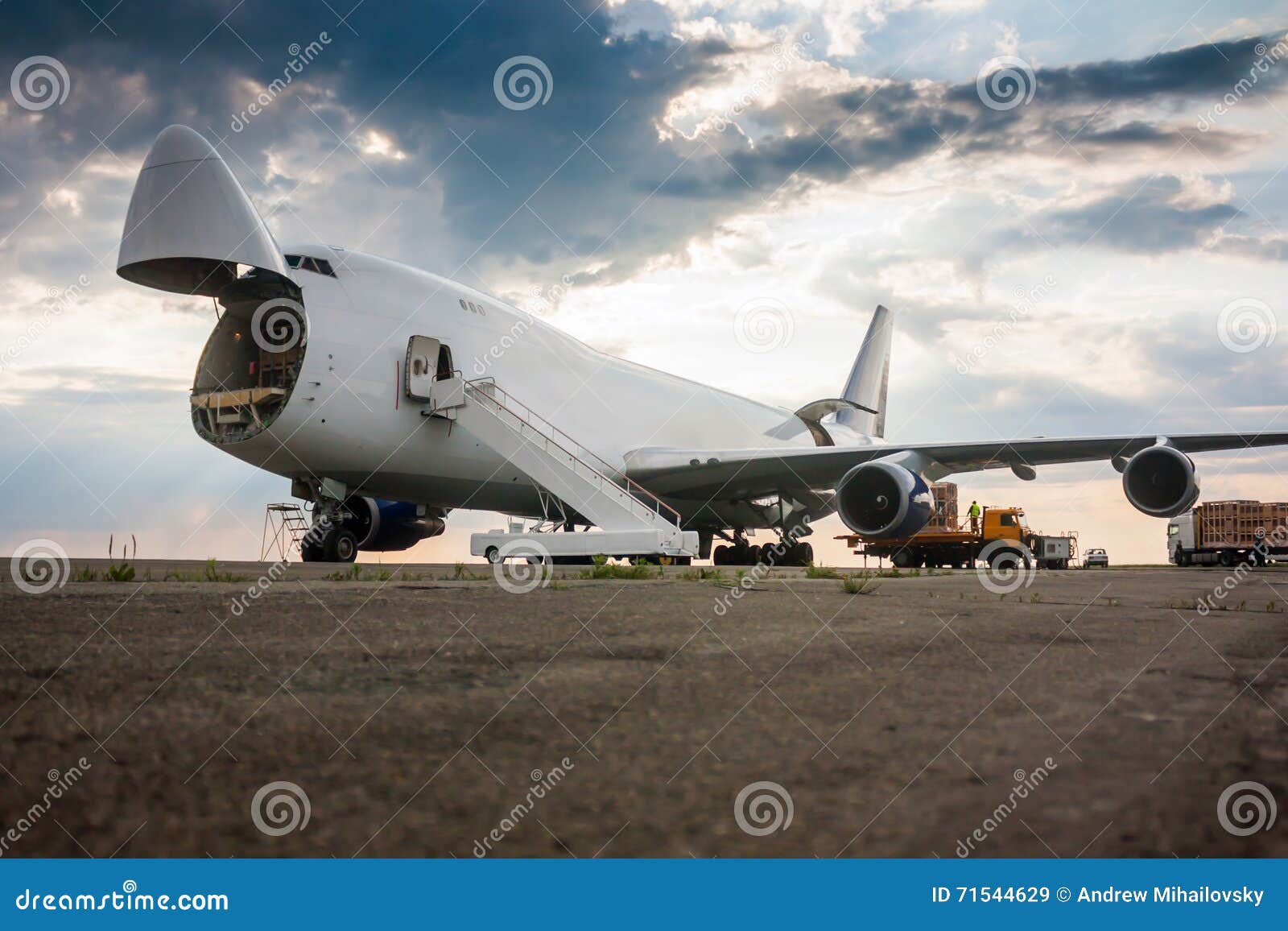 Unloading Widebody Cargo Airplane At The Airport Apron In The Morning ...