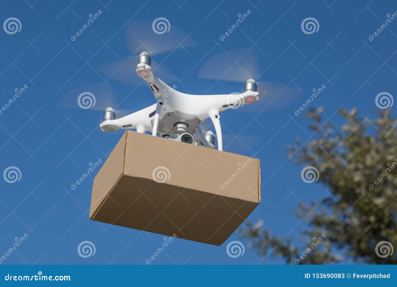 Unmanned Aircraft System UAV Quadcopter Drone Delivering Package Stock ...