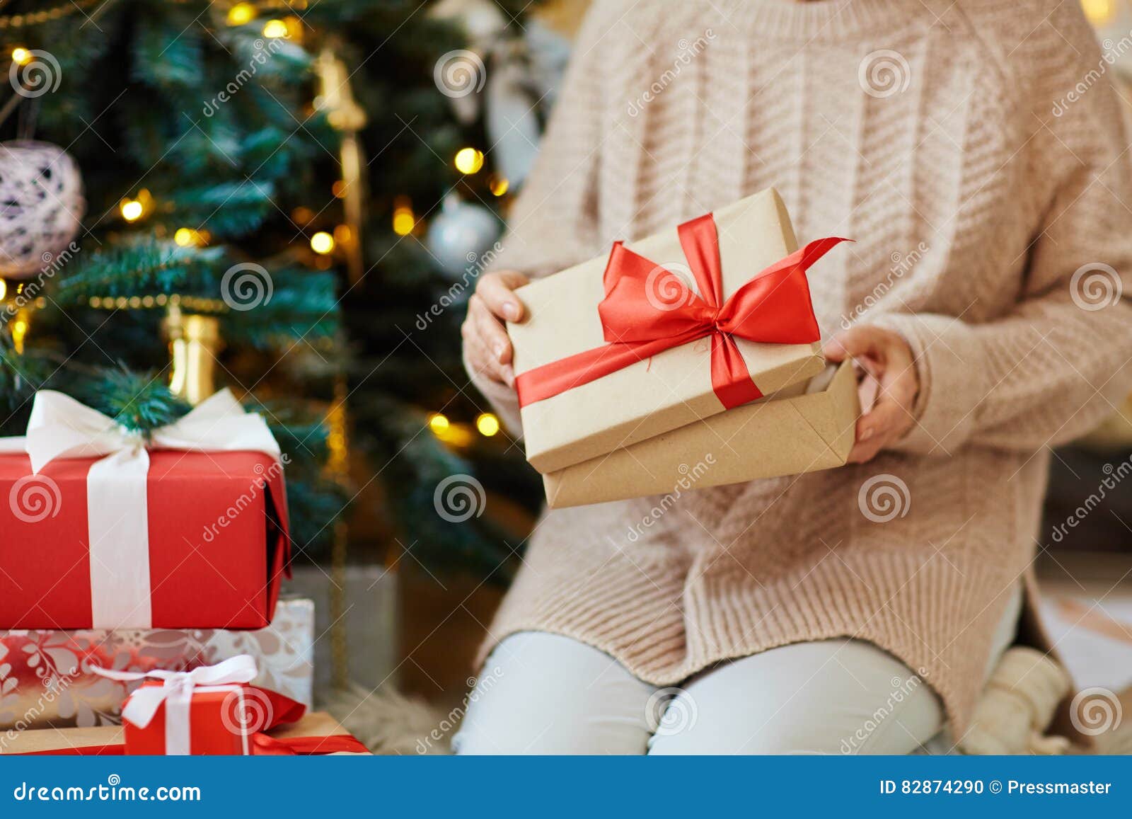 Unpacking gift stock photo. Image of grandparent, sweater - 82874290