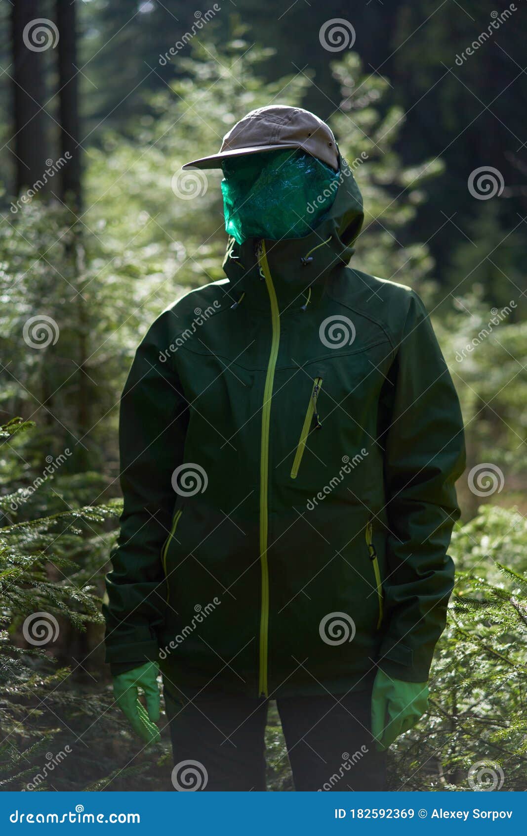 Unrecognizable Man in a Green Plastic Mask in the Forest As a Symbol ...