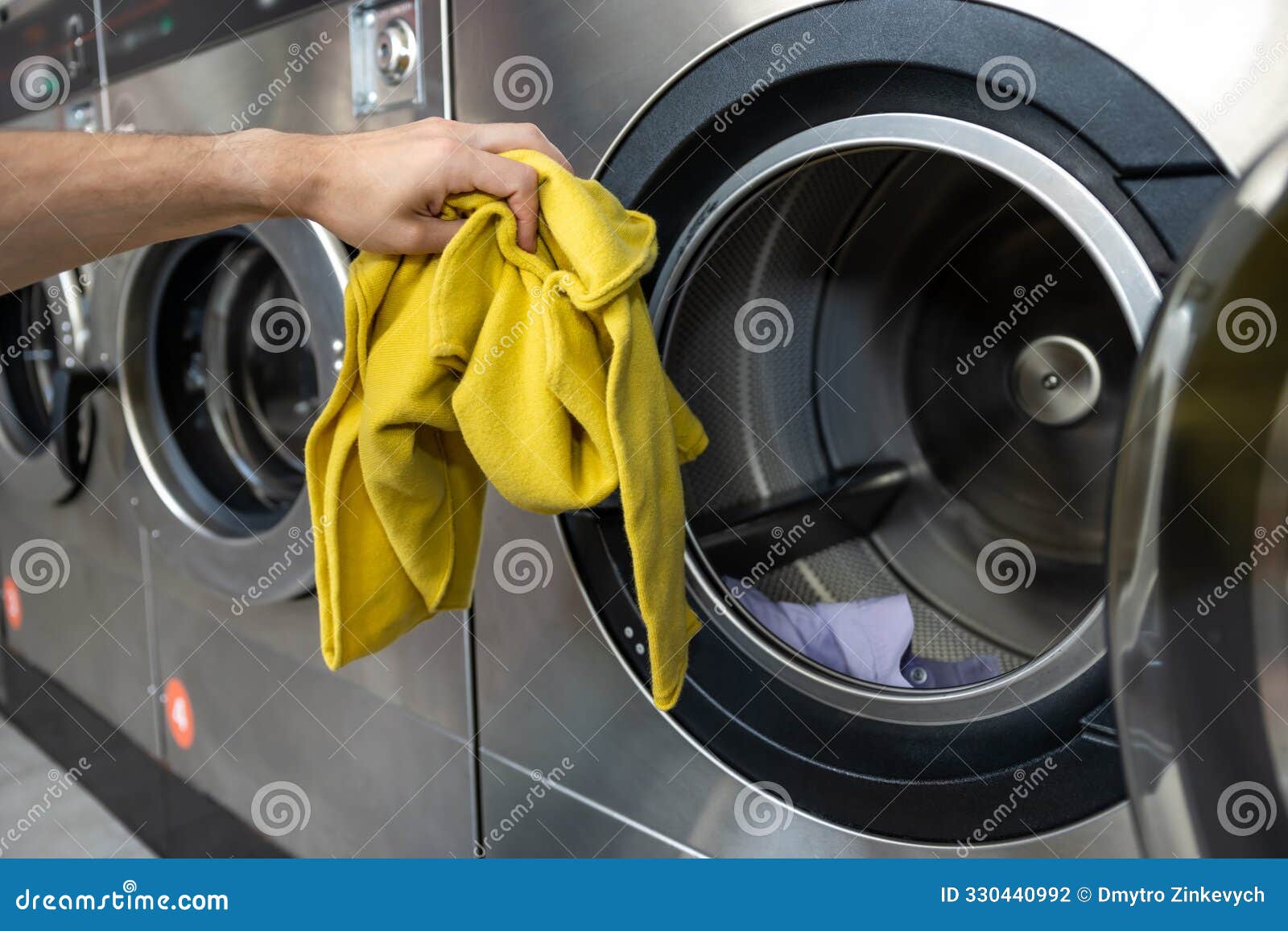 Unrecognizable Man Operating Using Washing Machine at Commercial ...