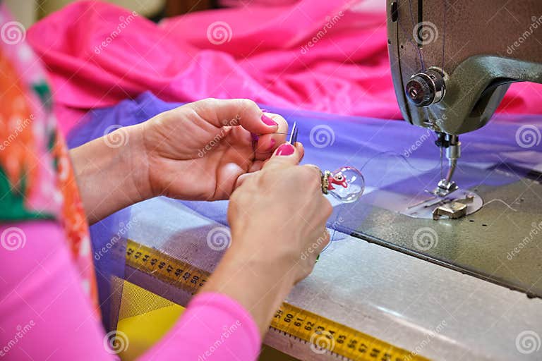 Unrecognizable Dressmaker Cutting the Thread To Threading Sewing ...