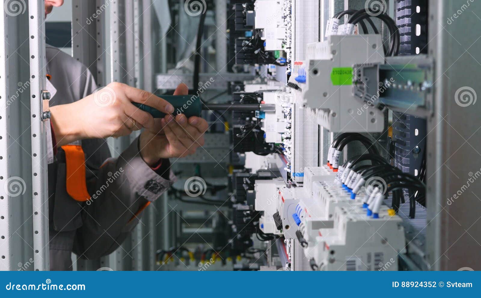 Unrecognizable Electircian Installing Electricequipment, Breakers into ...