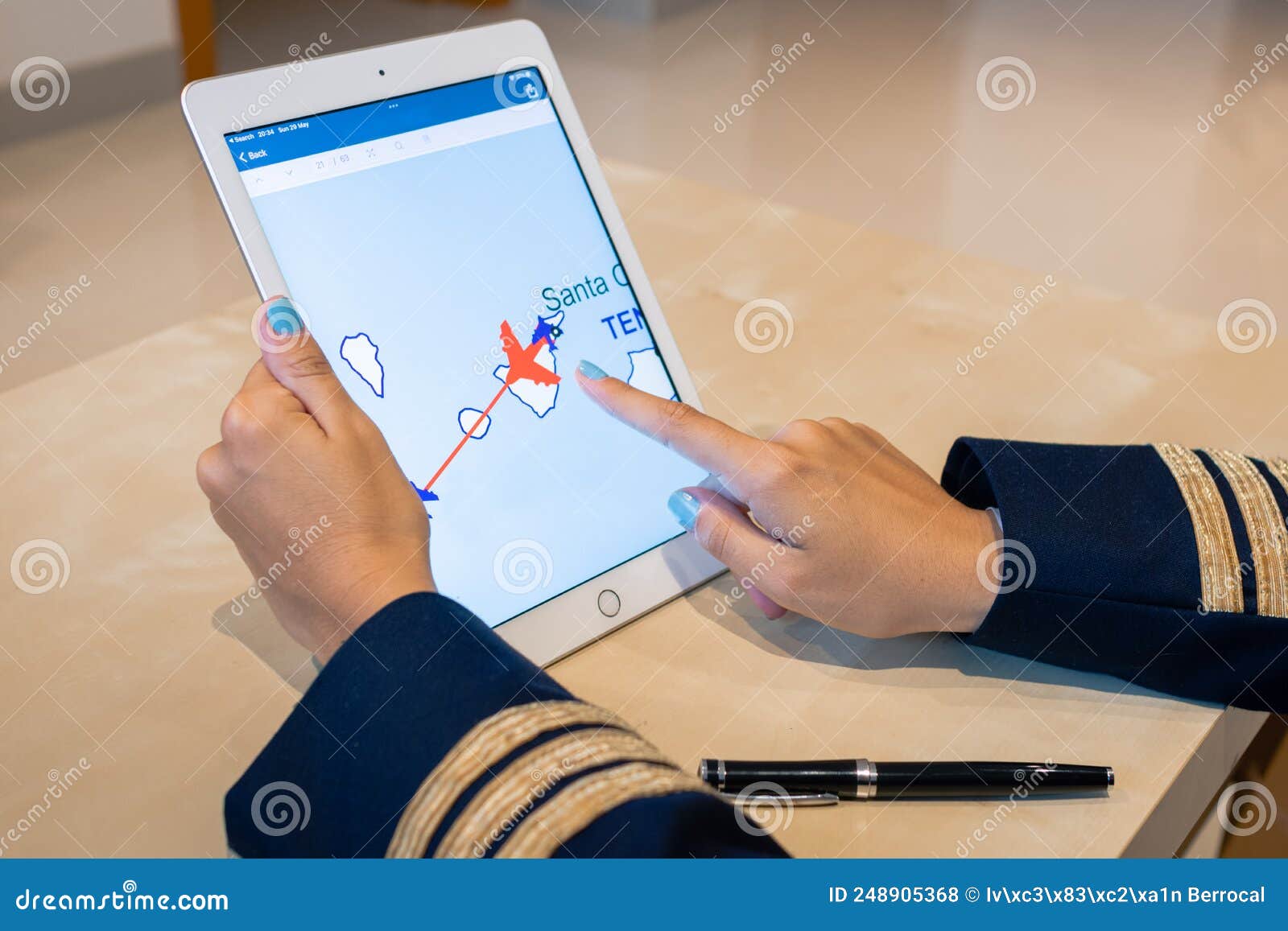 Unrecognizable Female Pilot Preparing Flight Documentation on a Tablet ...