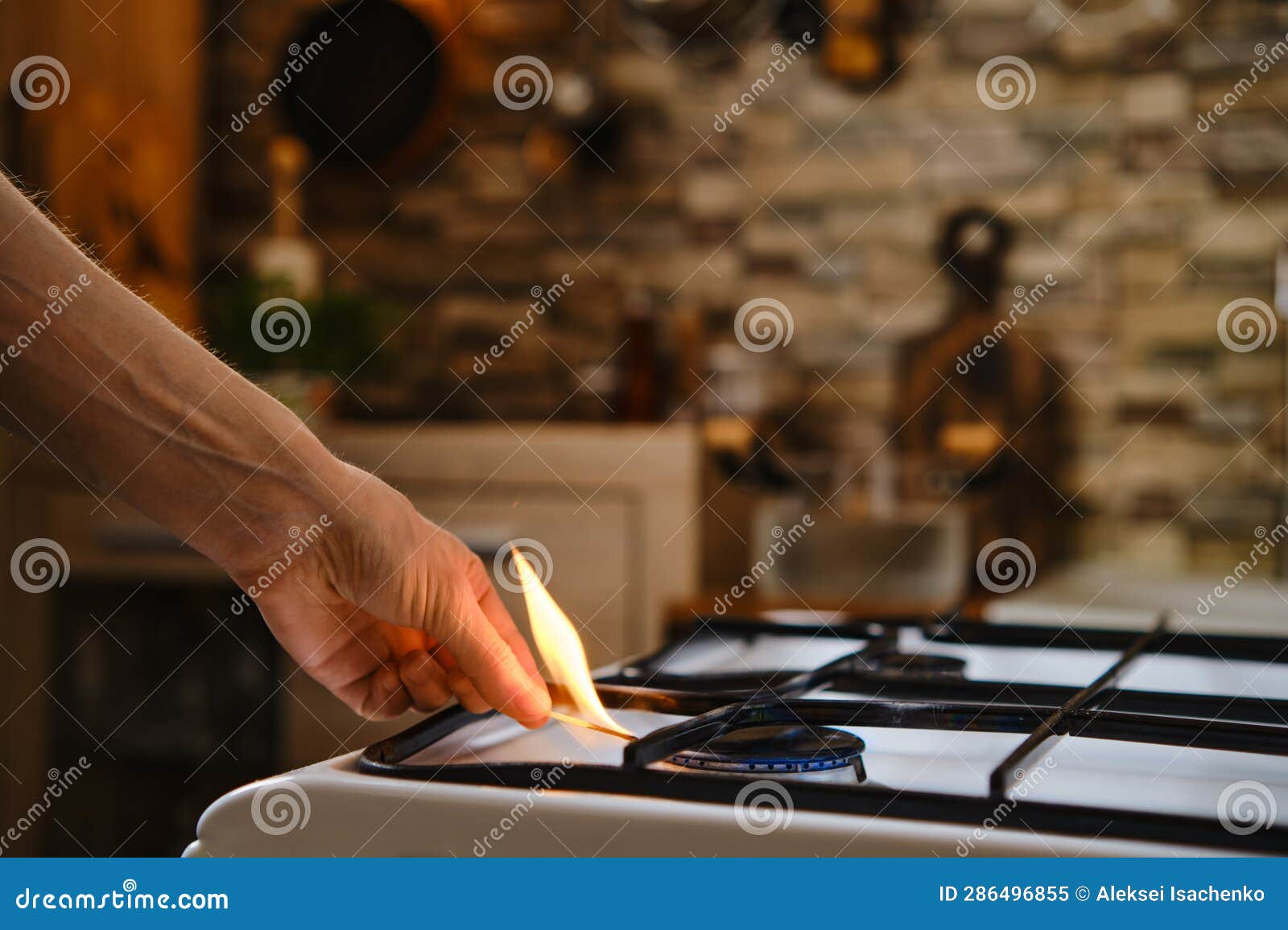 Man Lights A Gas Stove With A Match Close-up. Gas Stove With Burning ...
