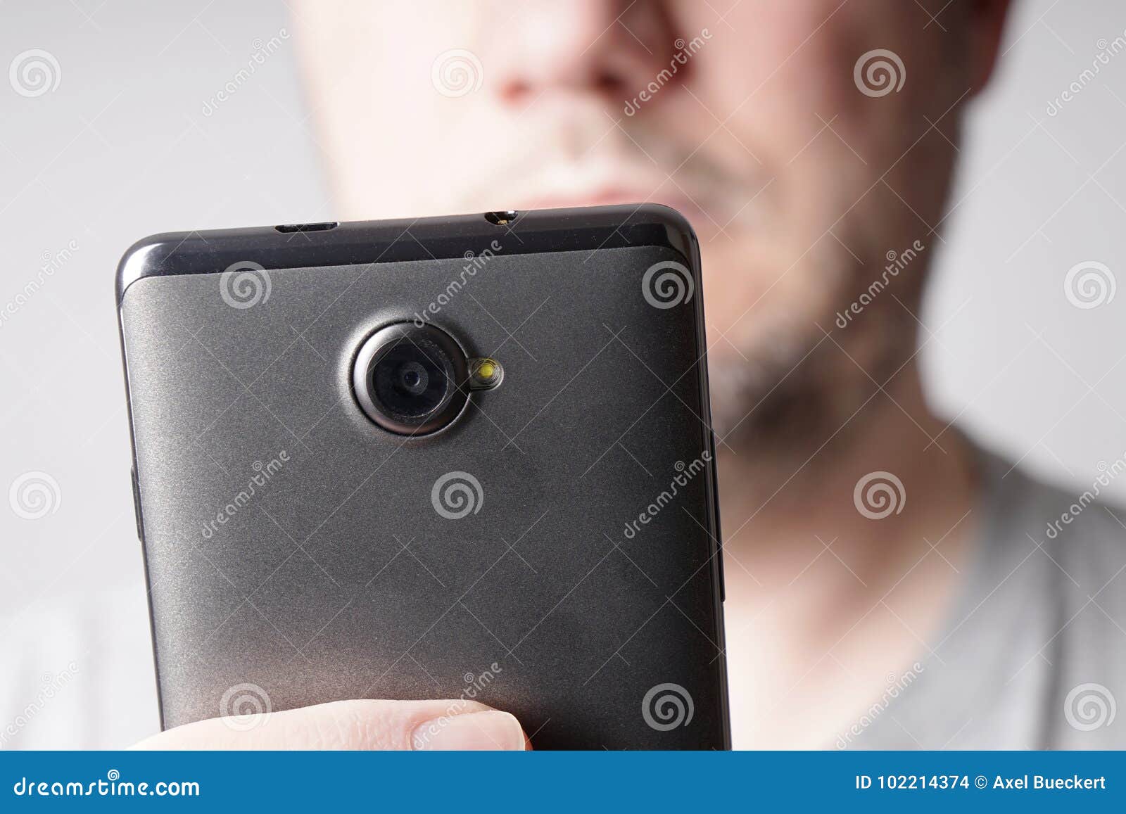 Unrecognizable Man Looking at Smart Phone Stock Photo - Image of gadget ... Unrecognizable Man Looking at Smart Phone Stock Photo - Image of gadget ...