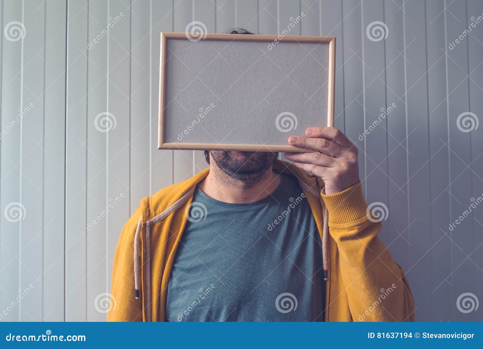 Unrecognizable Man Posing with Blank Picture Frame Over His Face Stock ...