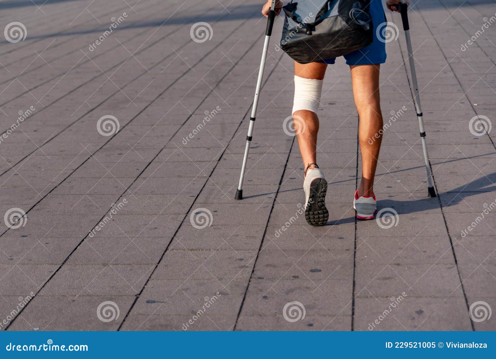 Unrecognizable Young Man with Crutches Walking in the City Stock Image ... Unrecognizable Young Man with Crutches Walking in the City Stock Image ...