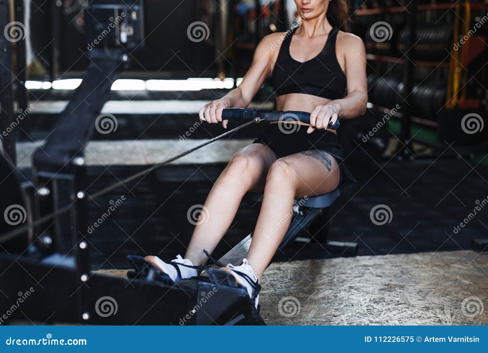 Unrecognizable Young Woman Using Rowing Machine Stock Image - Image of ...