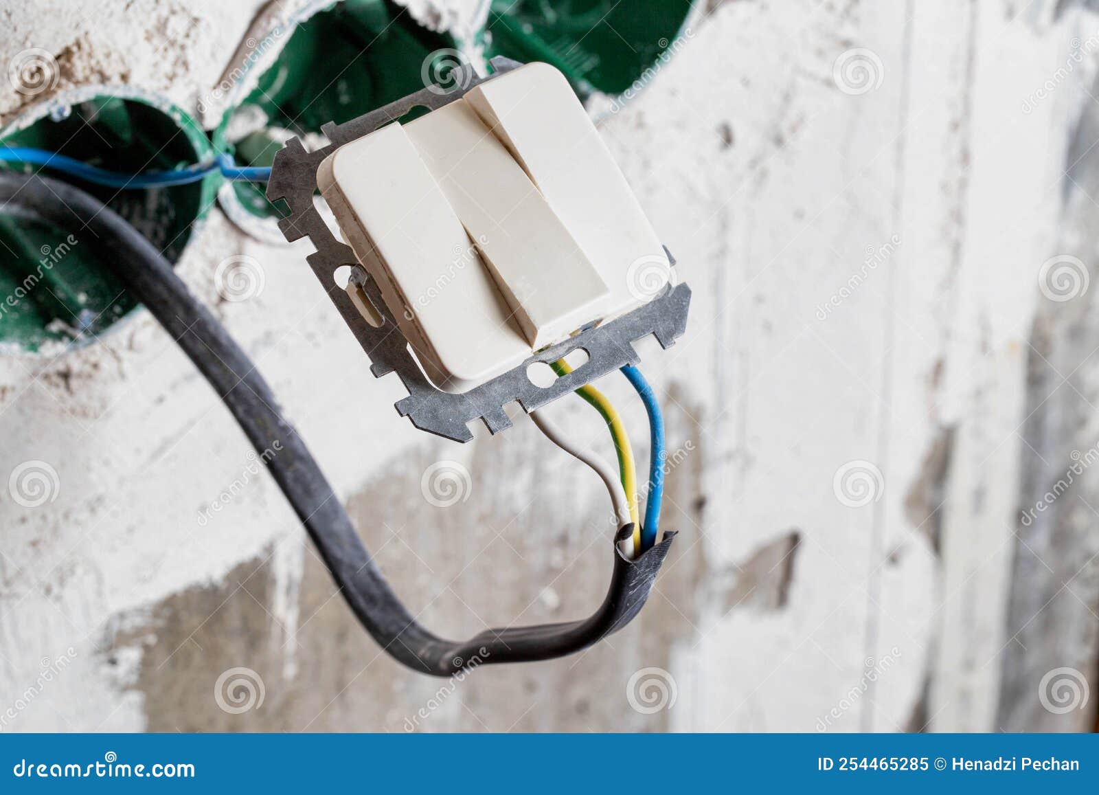 An Unsafe Electrical Switch Hangs on Wires. Electrical Safety, Close-up ...