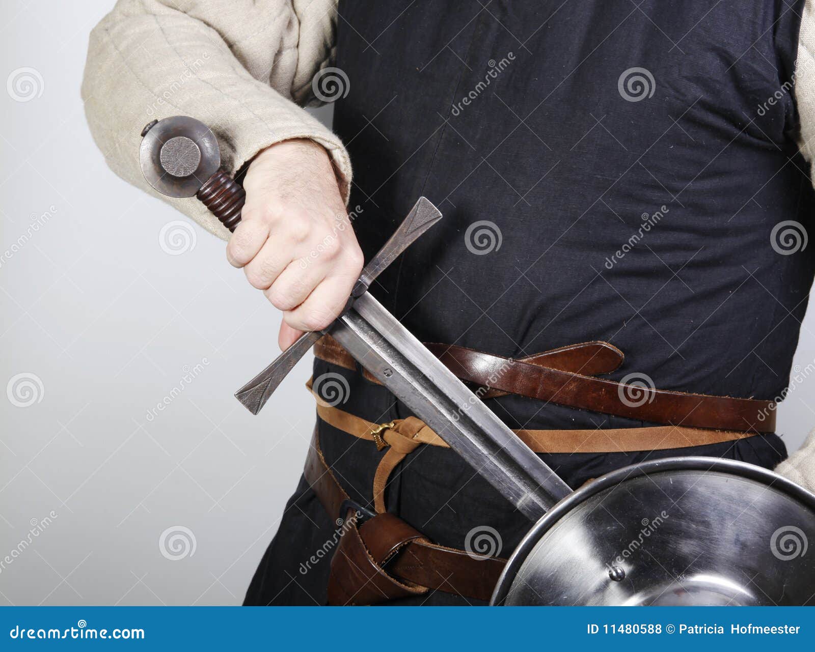 Unsheating a Medieval Sword Stock Photo - Image of onehander, medeviel ...
