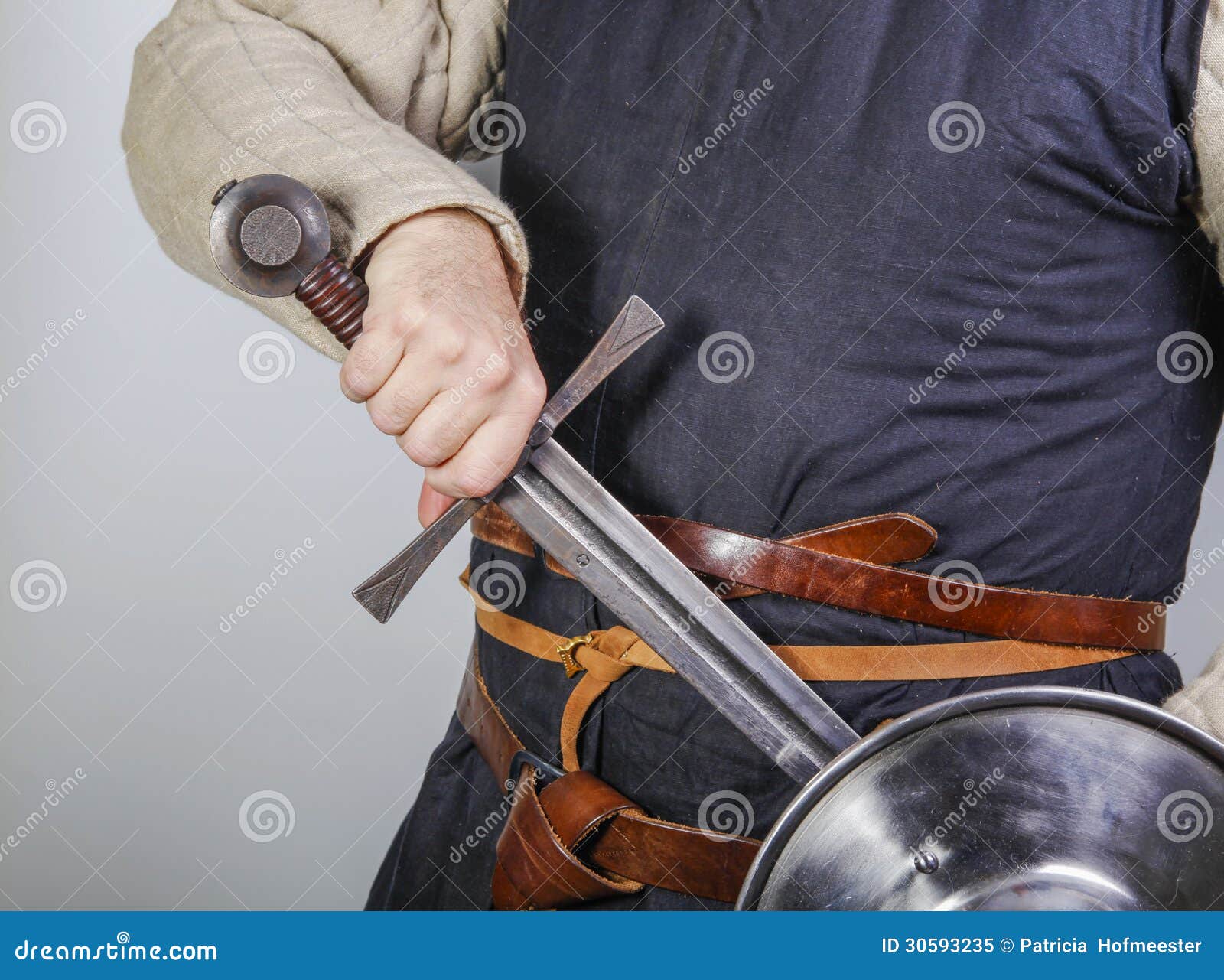 Unsheating a Medieval Sword Stock Image - Image of clothing, sword ...