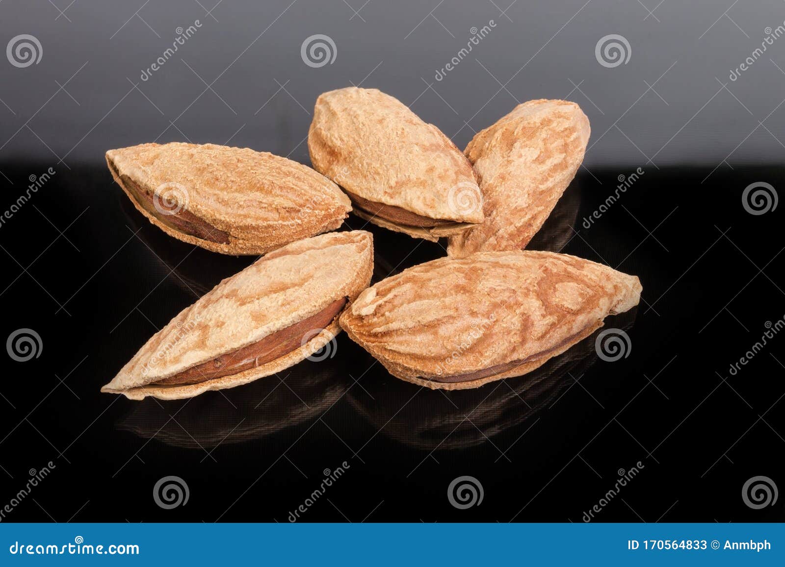 Unshelled Almonds Close-up on a Dark Reflective Surface Stock Image ...
