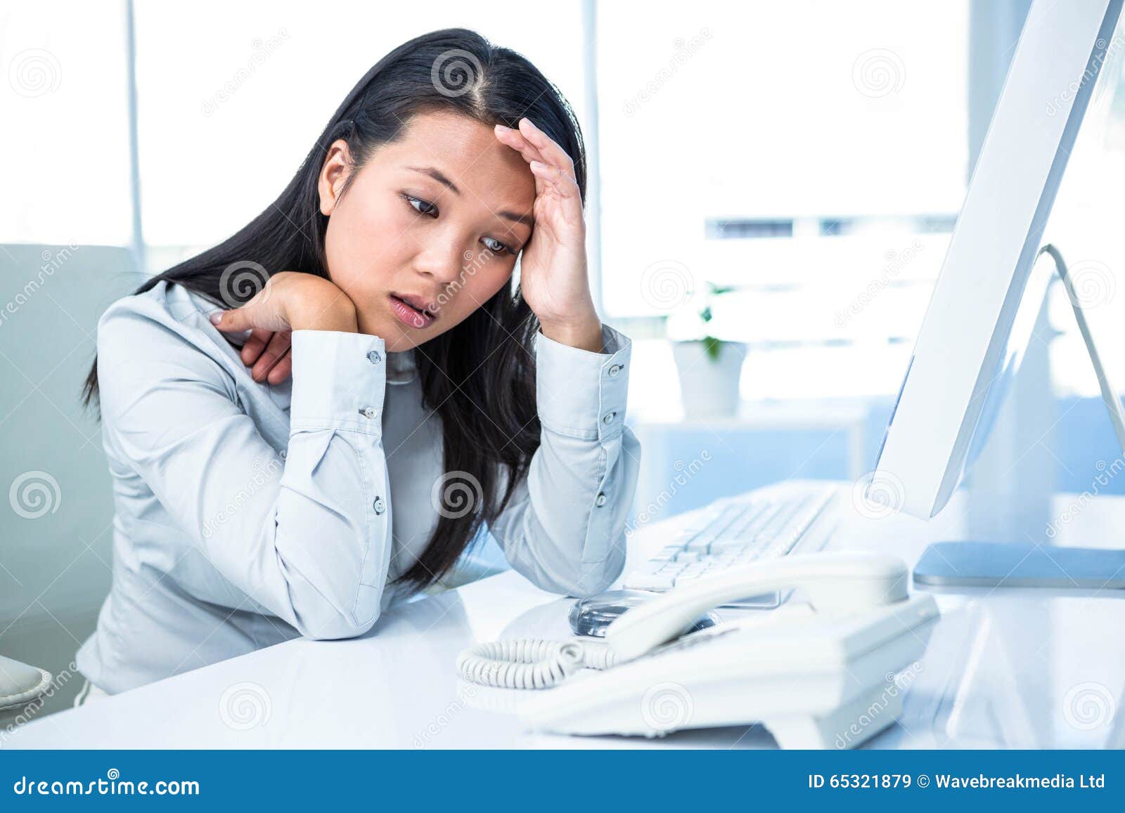 Unsmiling Businesswoman with Hands on Face Stock Image - Image of ...