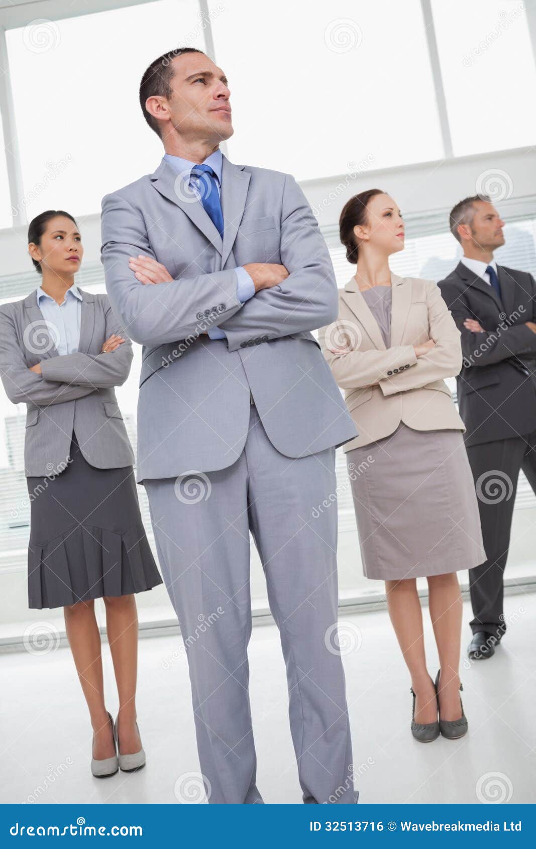 Unsmiling Work Team Posing while Looking in the Same Direction Stock ...