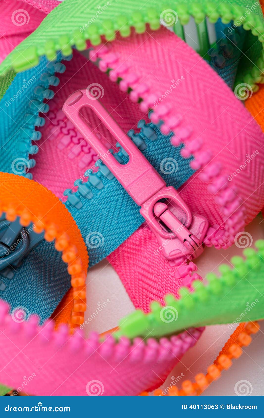 Unsorted colorful zippers stock image. Image of background - 40113063