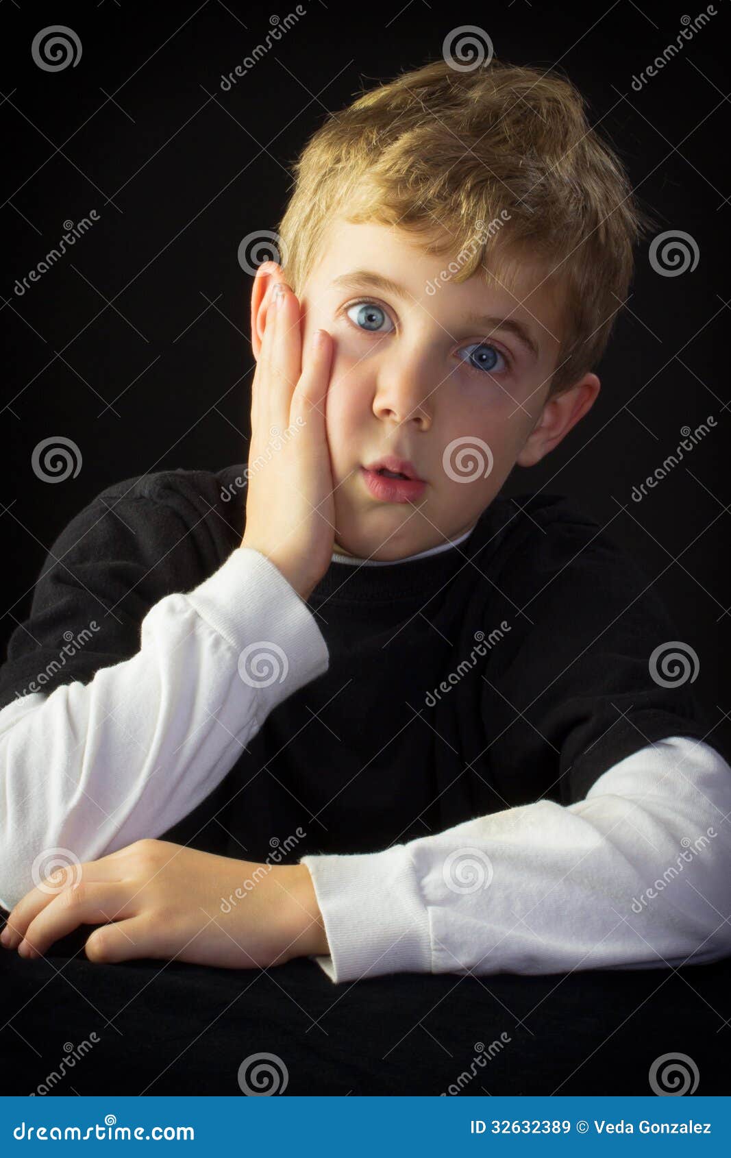 Unsure Young Boy stock image. Image of face, black, blue - 32632389