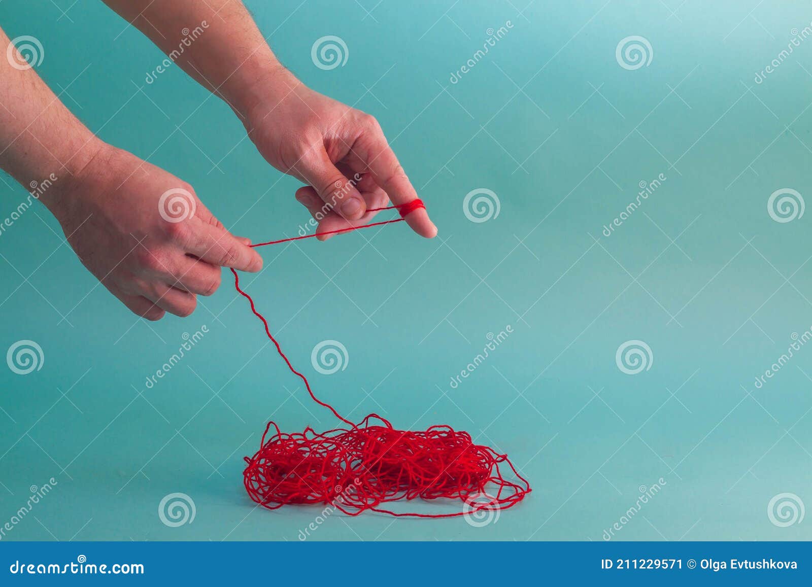 Untangle the Long Red Thread with Your Hands and Wind it into a Ball ...