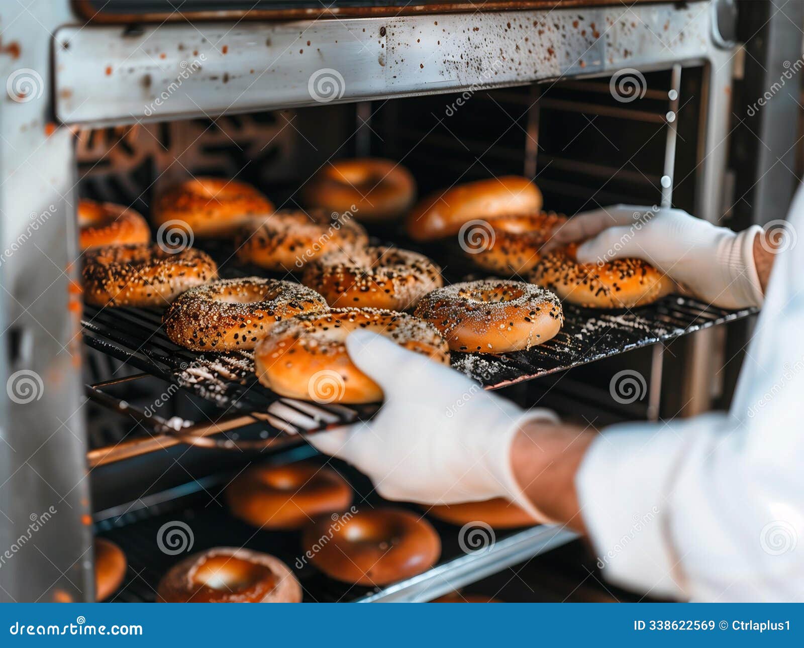 Baked Bagels. Chef Pulls Bagels Baked from the Hot Oven. the Process of ...