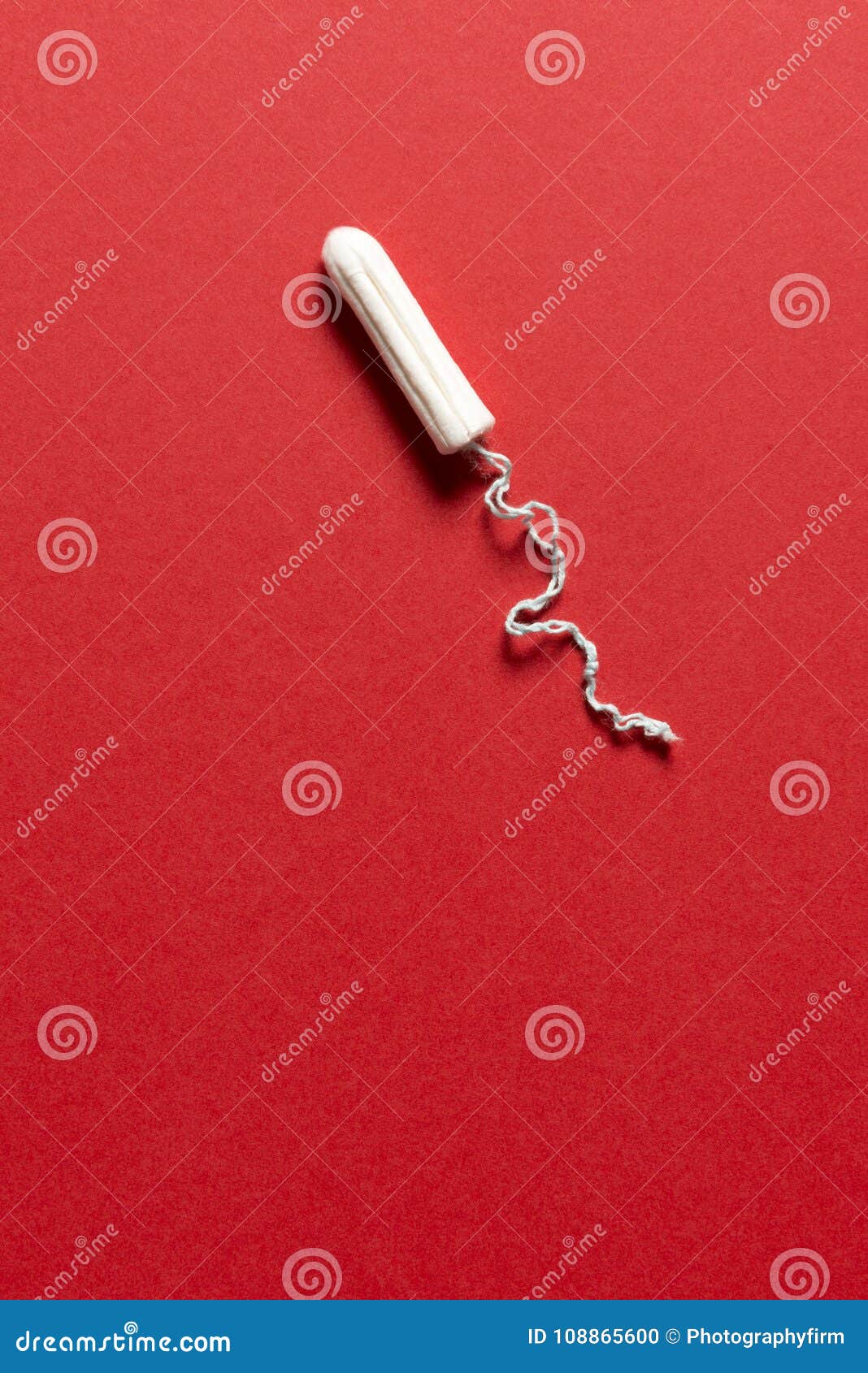 Unused Tampon on a Red Background with Copy Space Stock Photo - Image ...