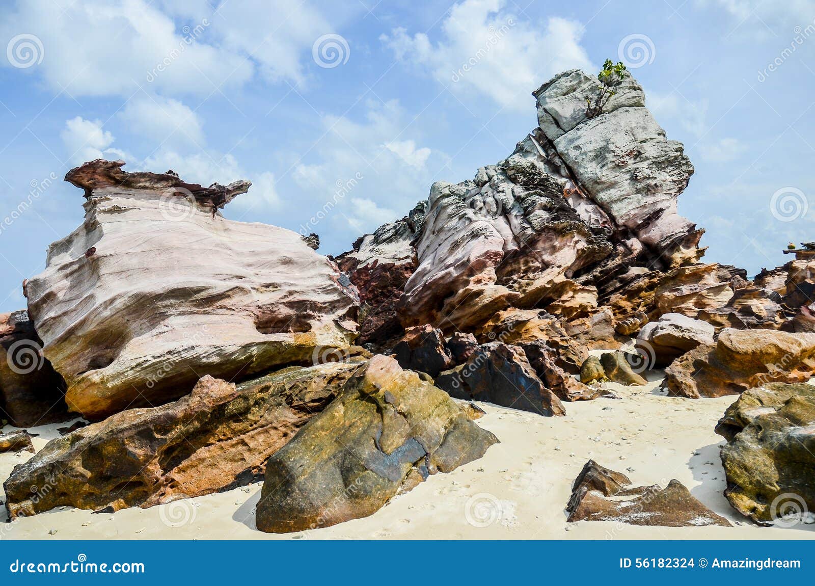 Unusual rocks on the beach stock photo. Image of horizon - 56182324