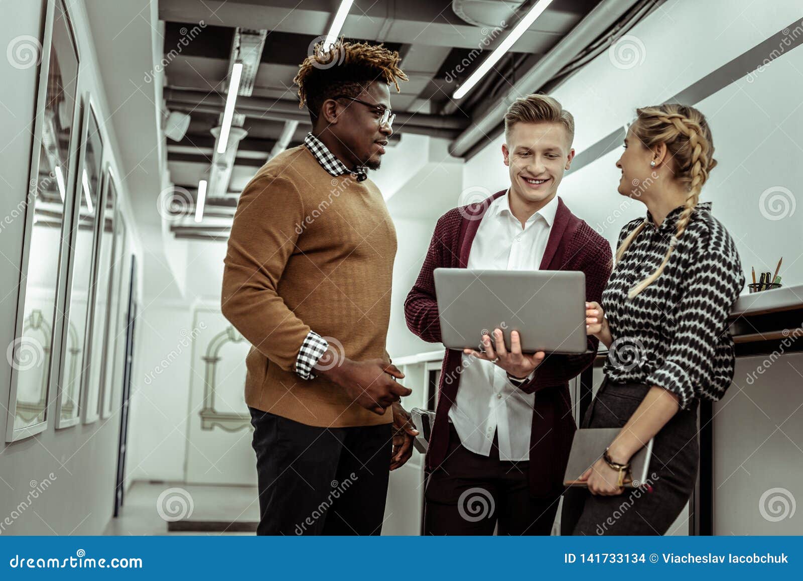 Unusual Smiling Colleagues Spending Great Time Together during Break ...